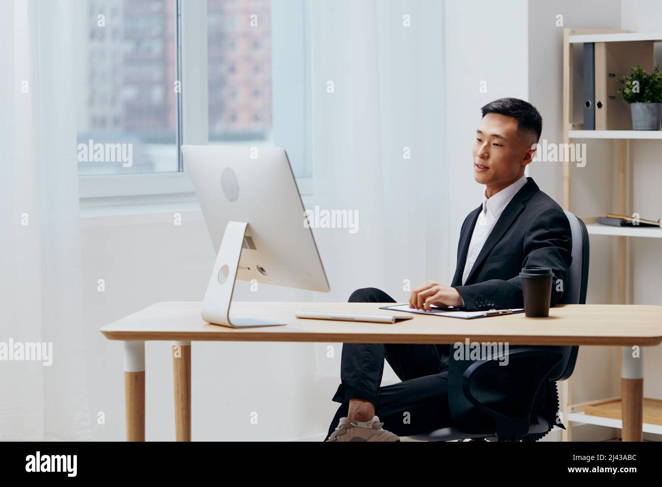 man sitting at a desk in front of a computer emotions Workspace Stock ...