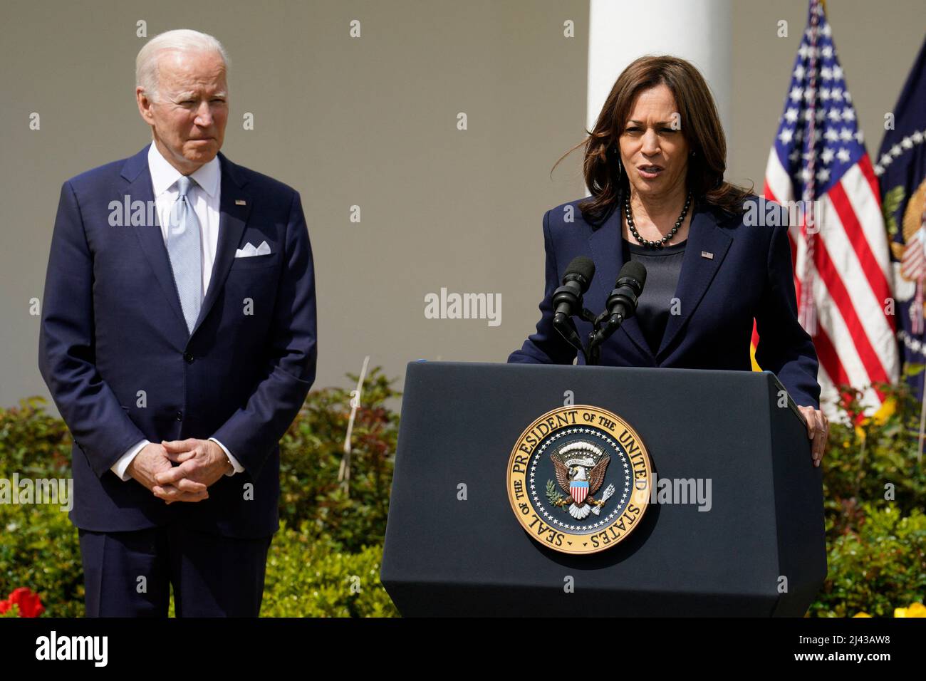 U.S. President Joe Biden listens to Vice President Kamala Harris as she ...