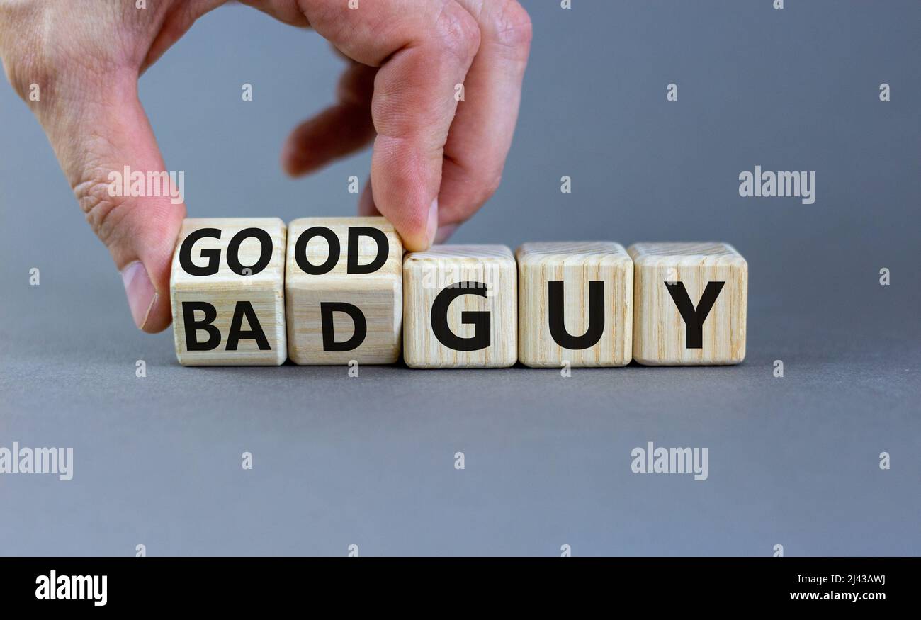 Good or bad guy symbol. Businessman turns cubes and changes concept ...