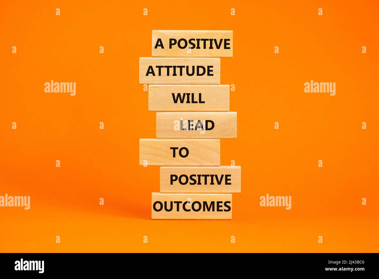 Think positive symbol. Wood blocks with words A positive attitude will ...