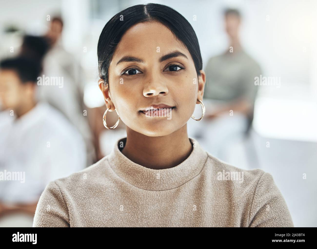 I got my game face on. Shot of a businesswoman smiling at a business ...