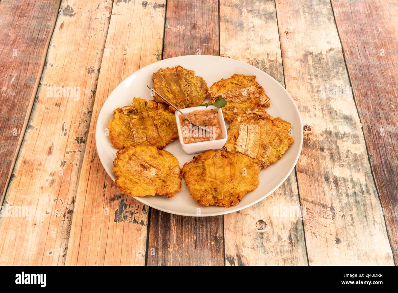 The fried patacón is a meal based on fried and flattened pieces of ...