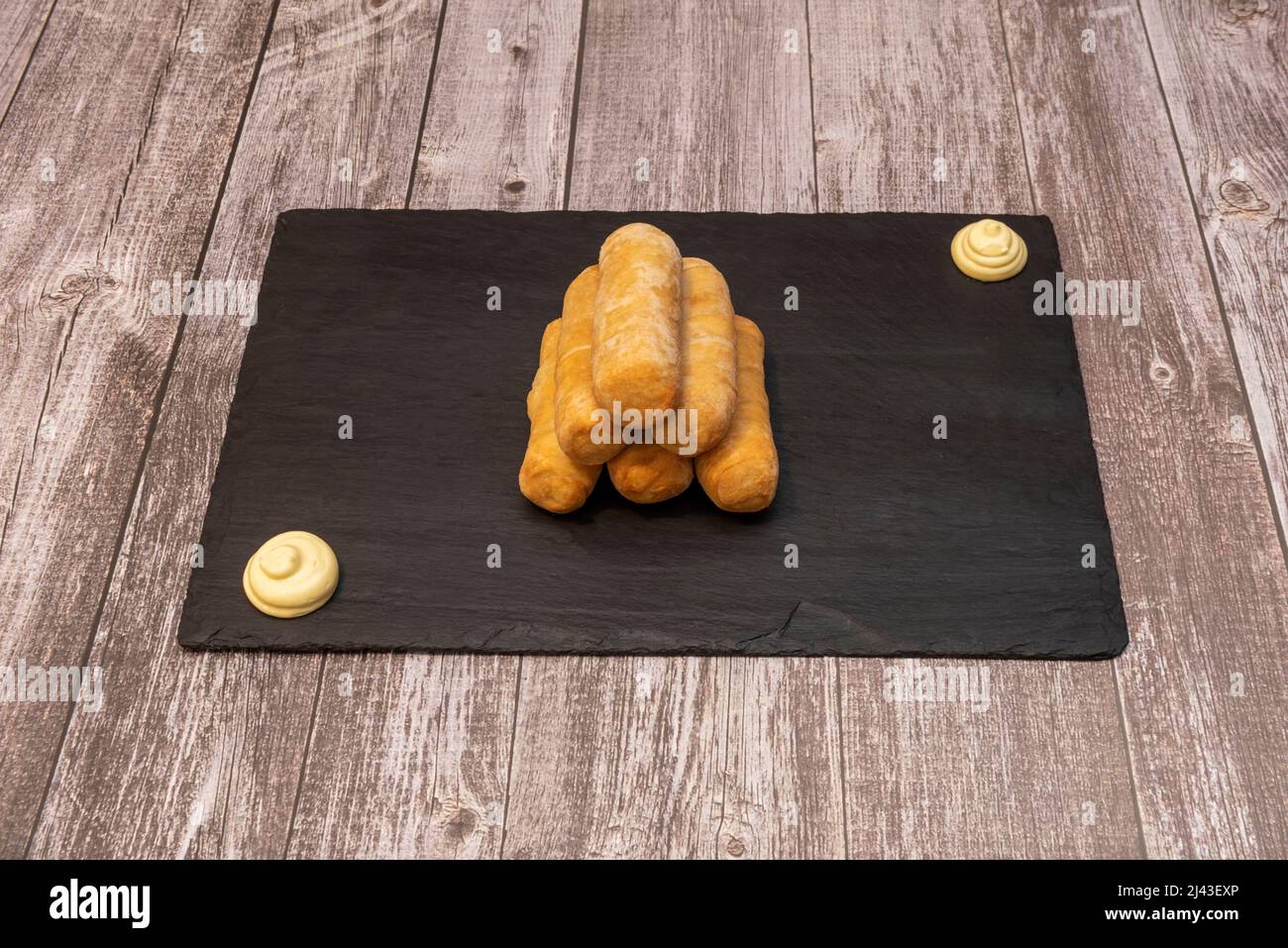 Dedito de queso or tequeño is a fried breaded cheese stick or spear of ...