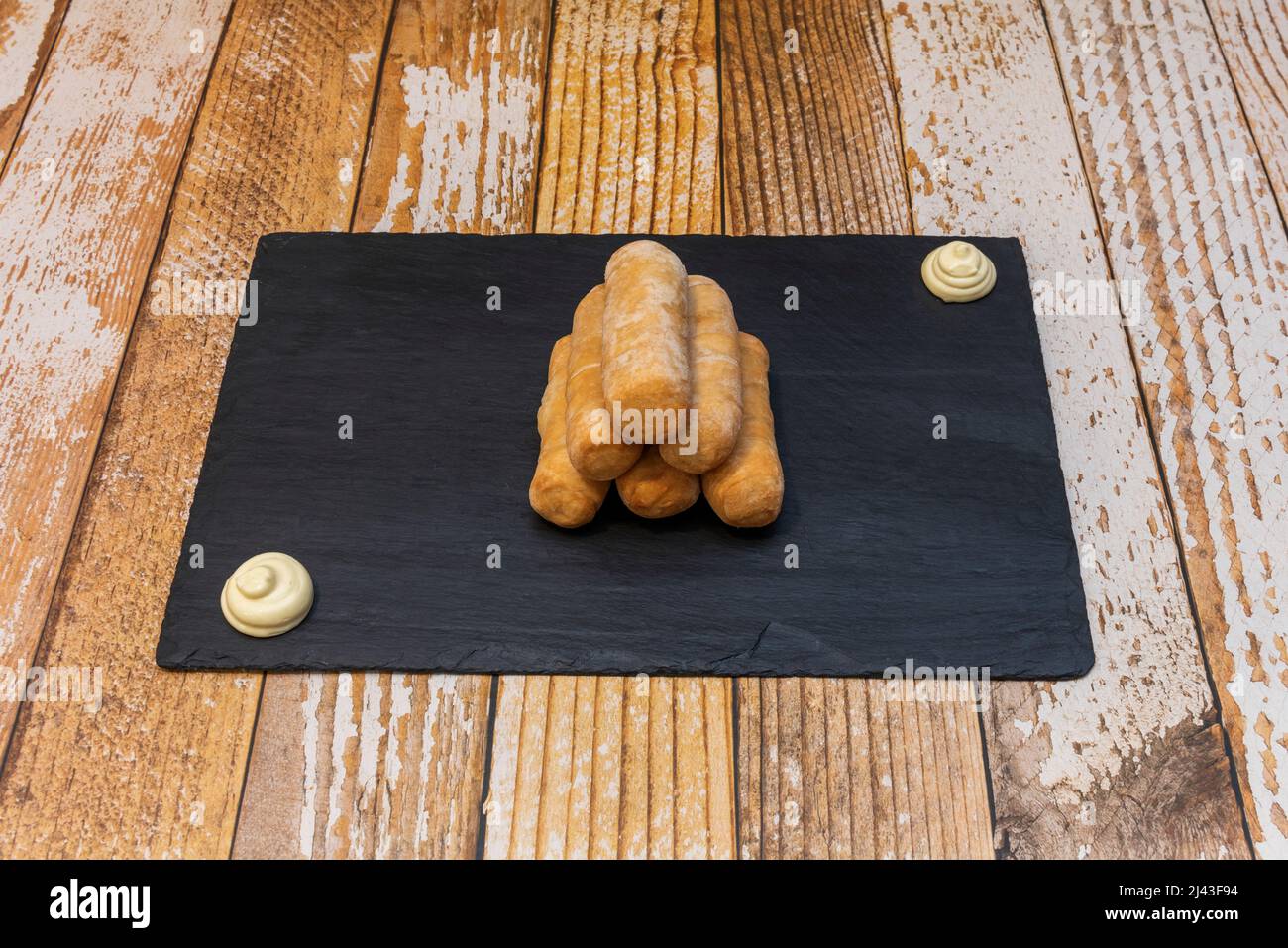 Dedito de queso or tequeño is a fried breaded cheese stick or spear of ...