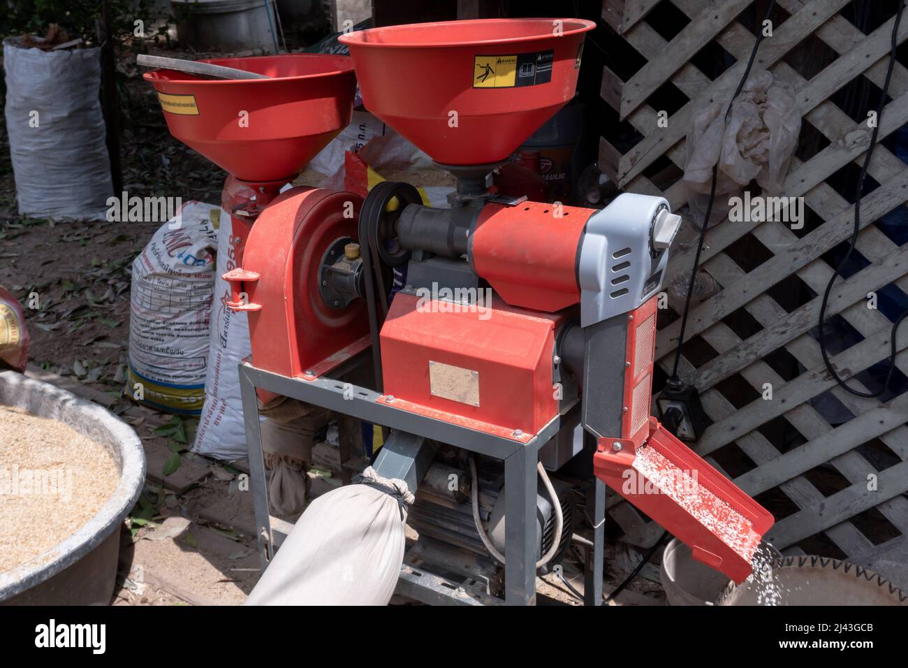 Mini electric rice milling machine Stock Photo - Alamy