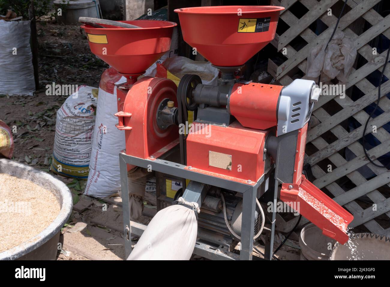 Mini electric rice milling machine Stock Photo - Alamy
