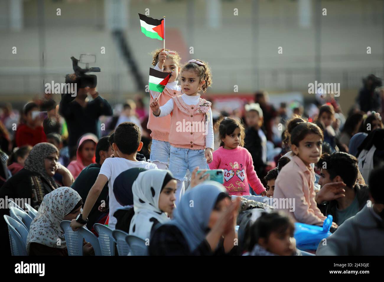 Palestinian children seen carrying Palestinian flags during a party for ...