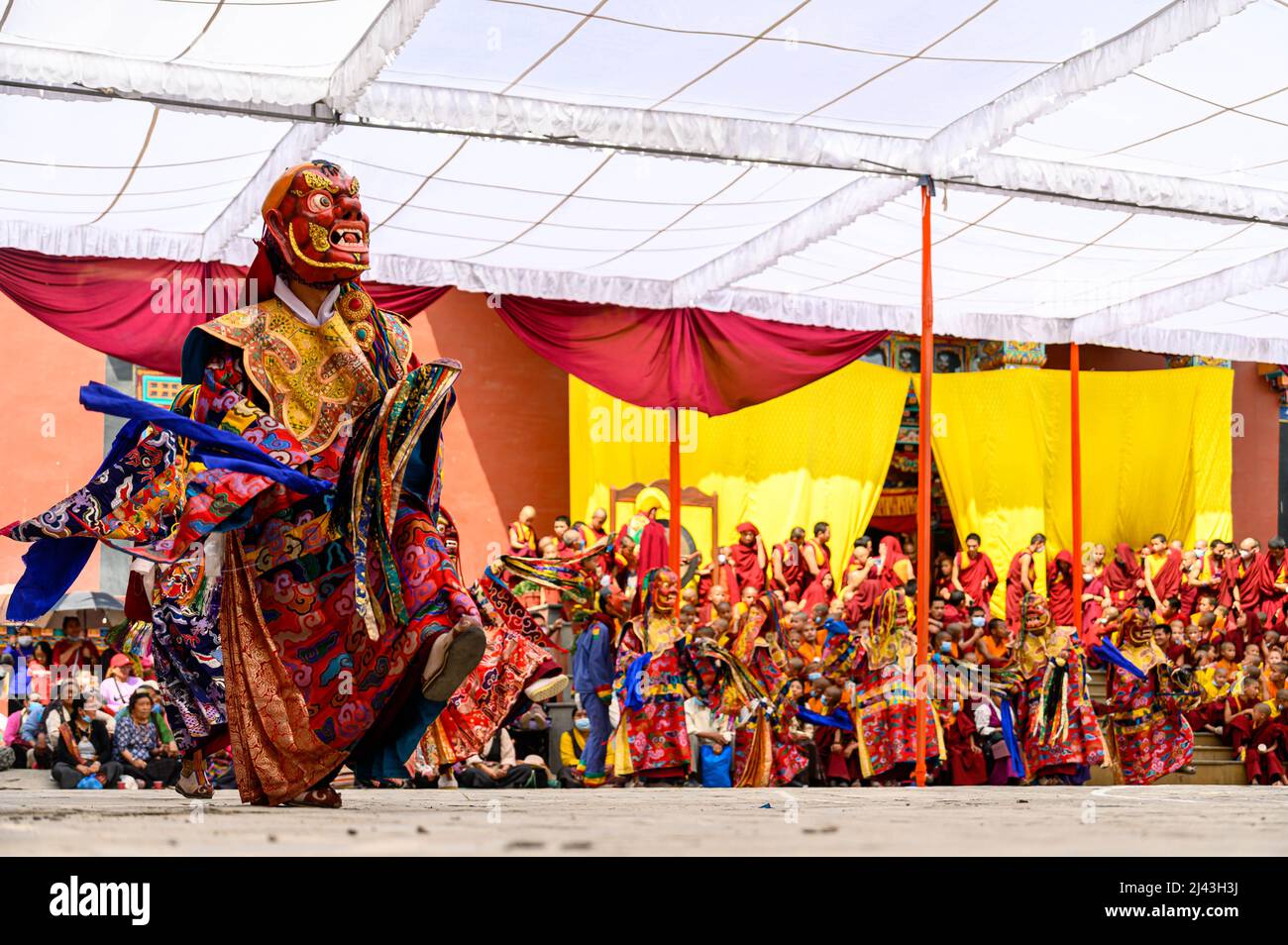 Masked dancers dressed in the traditional attire performe a spiritual ...