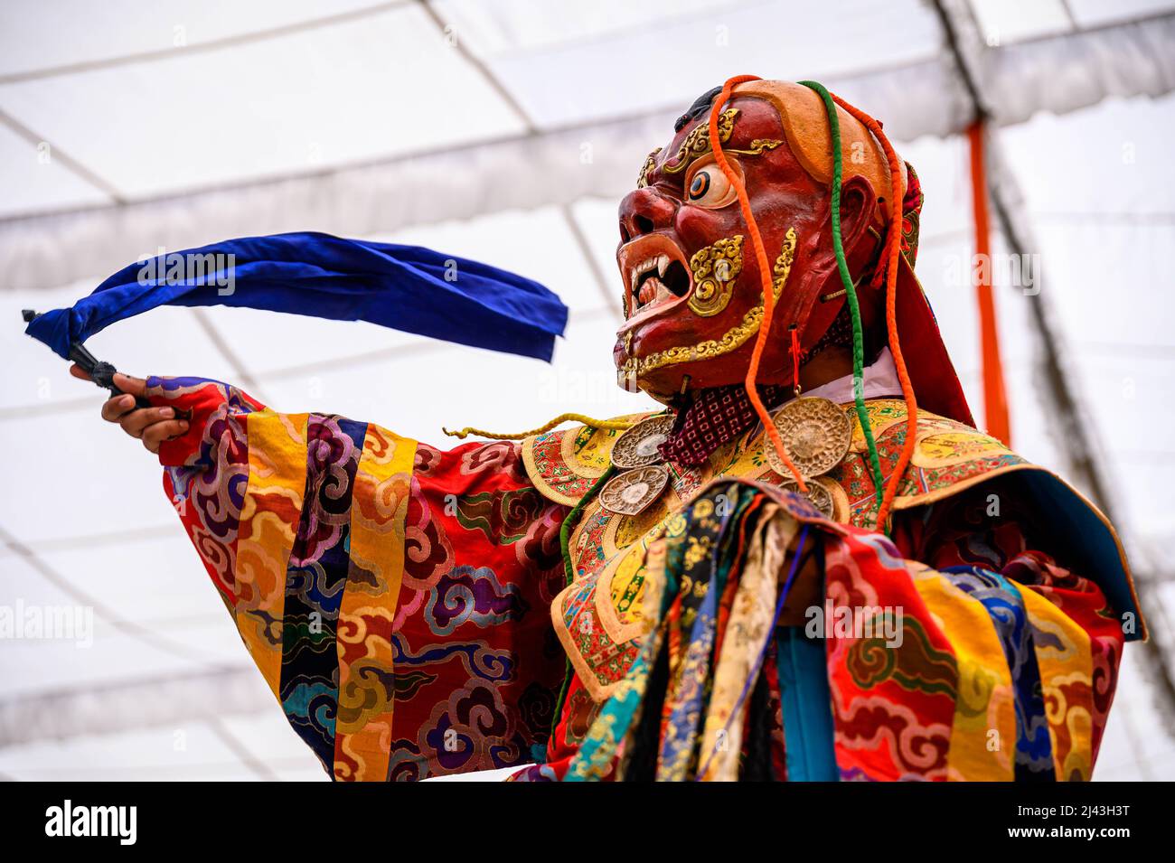 Masked dancers dressed in the traditional attire performe a spiritual ...