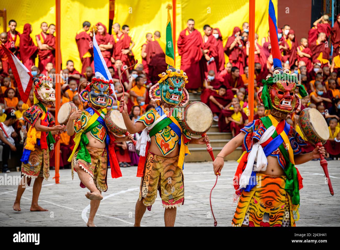 Masked dancers dressed in the traditional attire performe a spiritual ...
