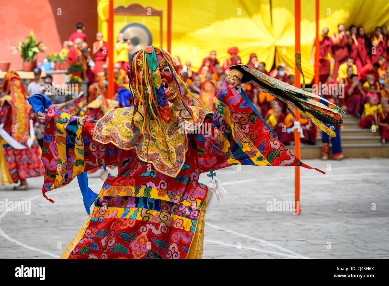 Masked dancers dressed in the traditional attire performe a spiritual ...