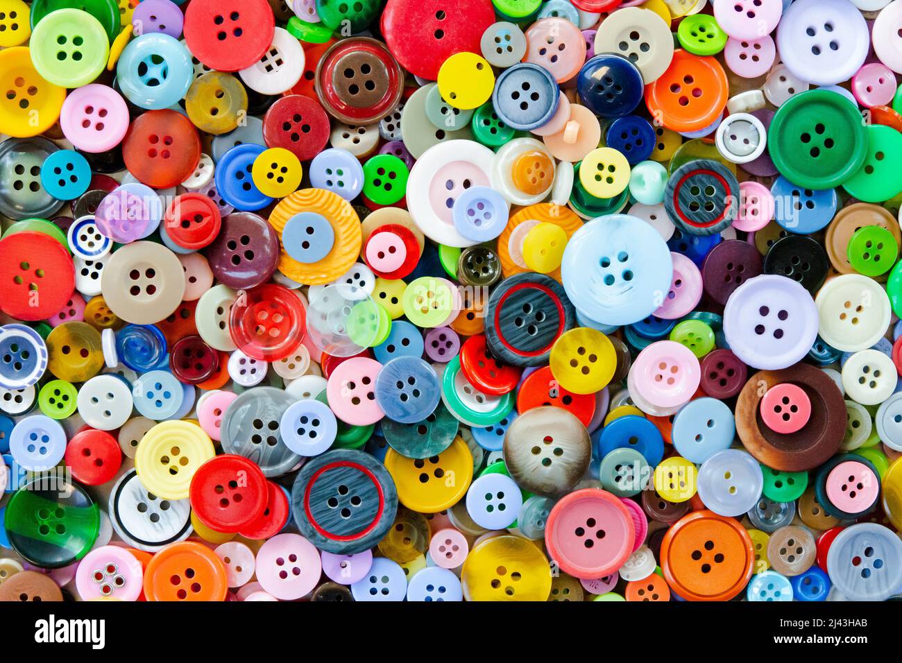 Colorful mixed sewing buttons background. Top view Stock Photo - Alamy