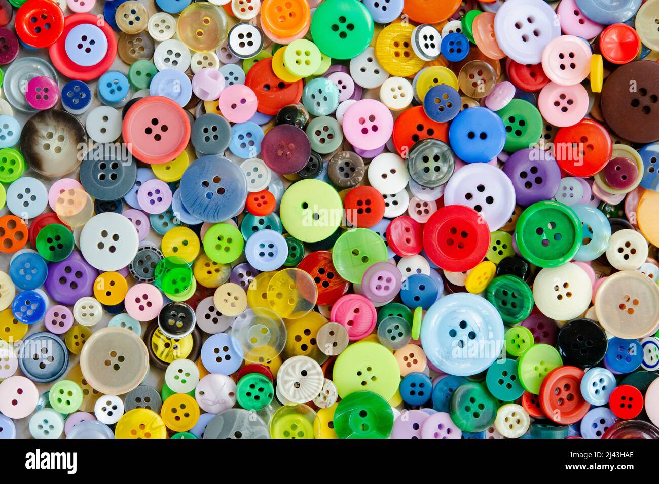 Colorful mixed sewing buttons background. Top view Stock Photo - Alamy