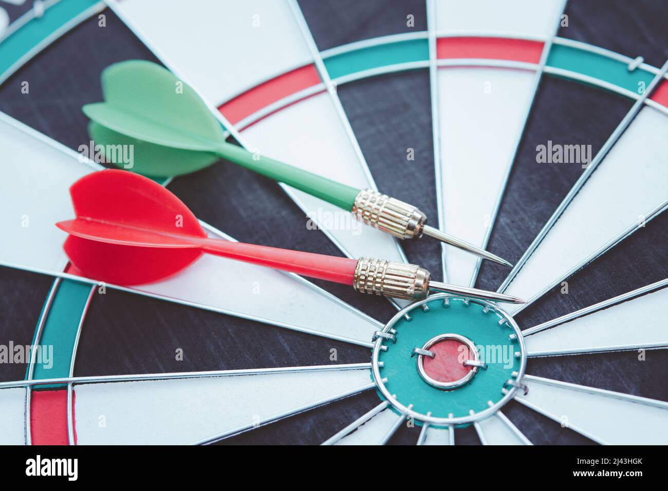 Red and Green dart arrow in on Bullseye target dartboard Stock Photo ...