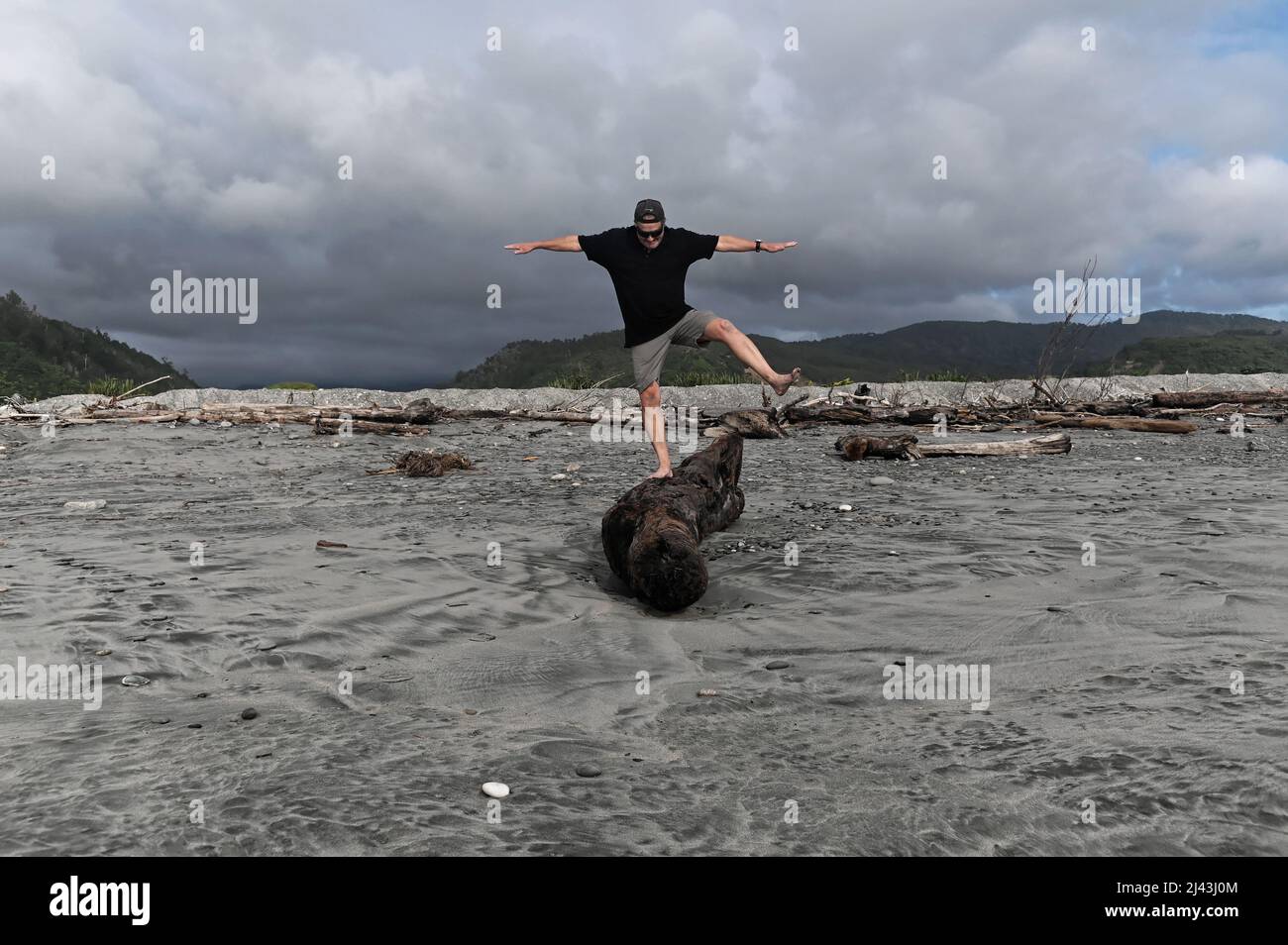 Man behaving badly, an older man is testing his balance by standing on ...