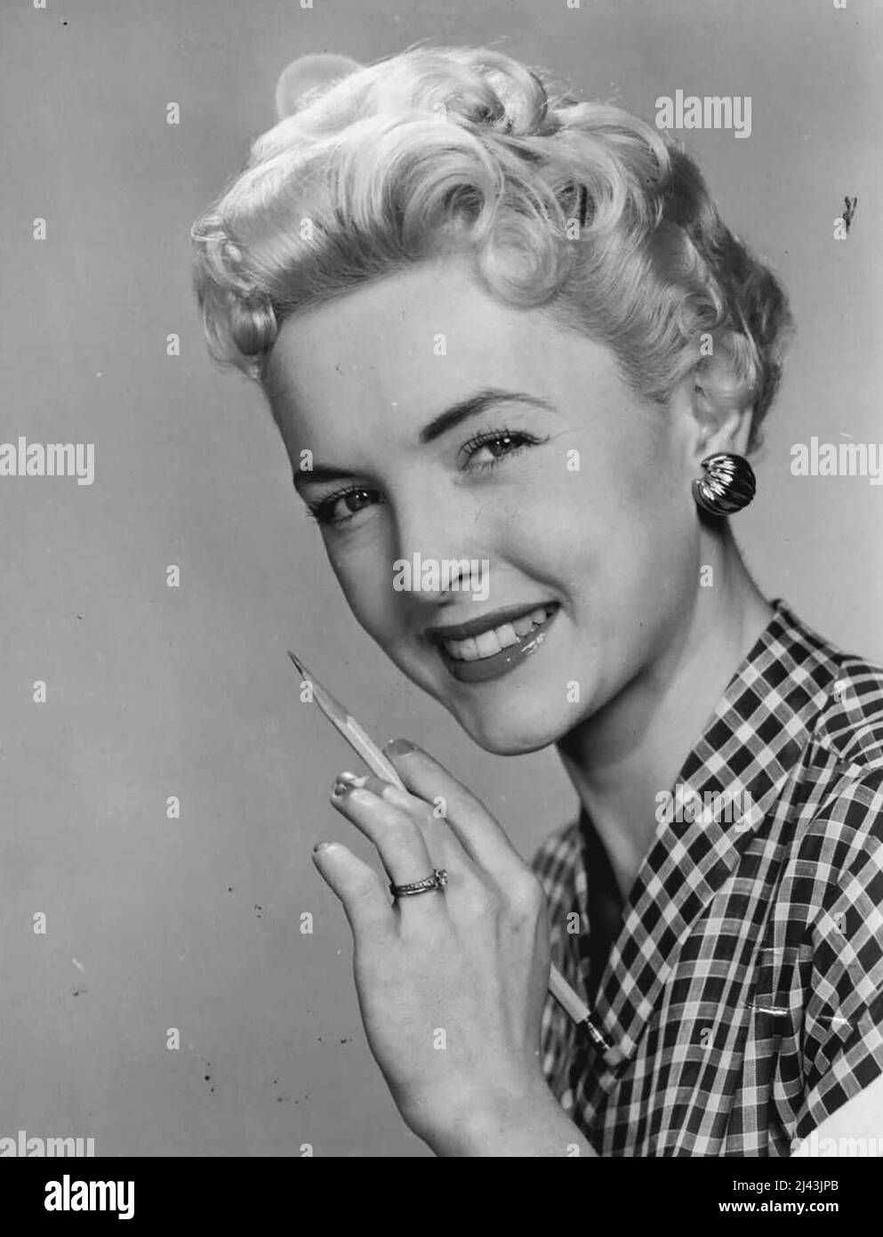 Shell-like earrings conceal the receiver of the latest in hearing aids ...