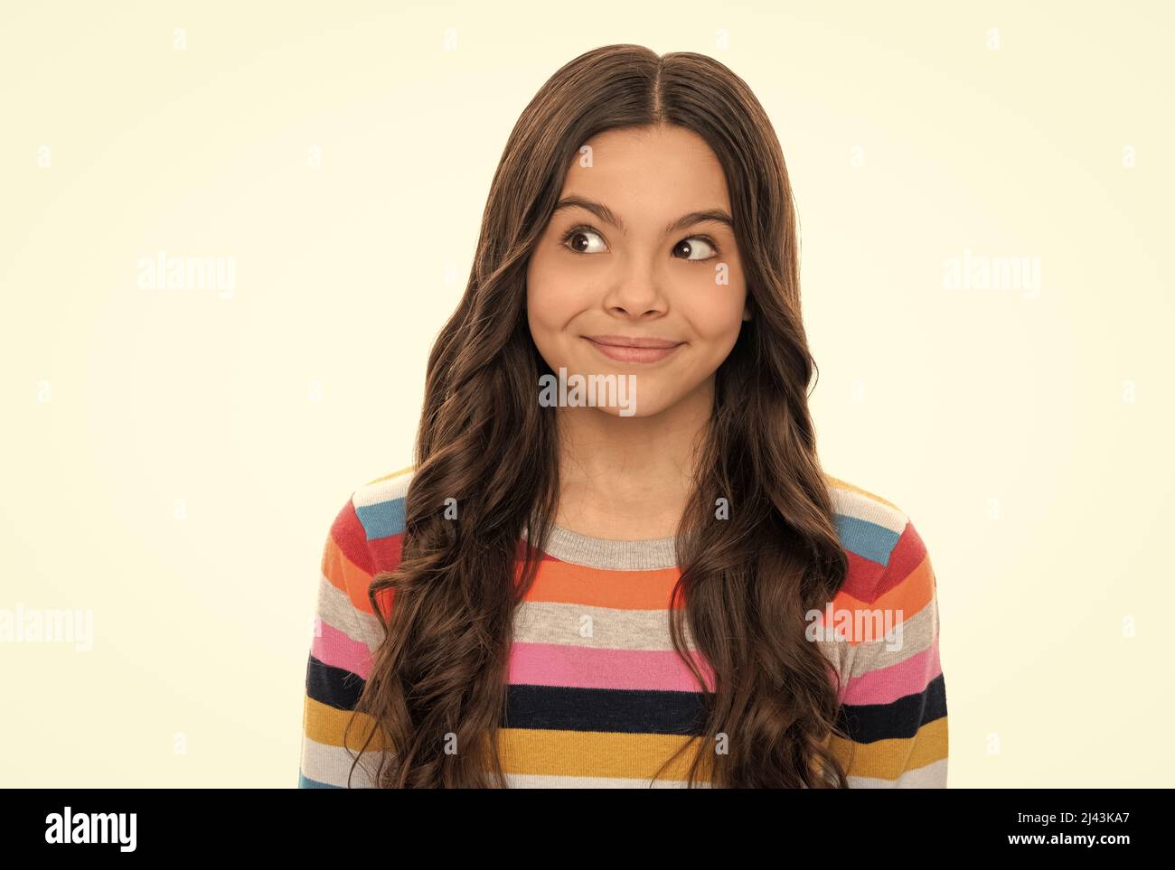 Girl child portrait with cheeky look in striped sweater isolated on ...