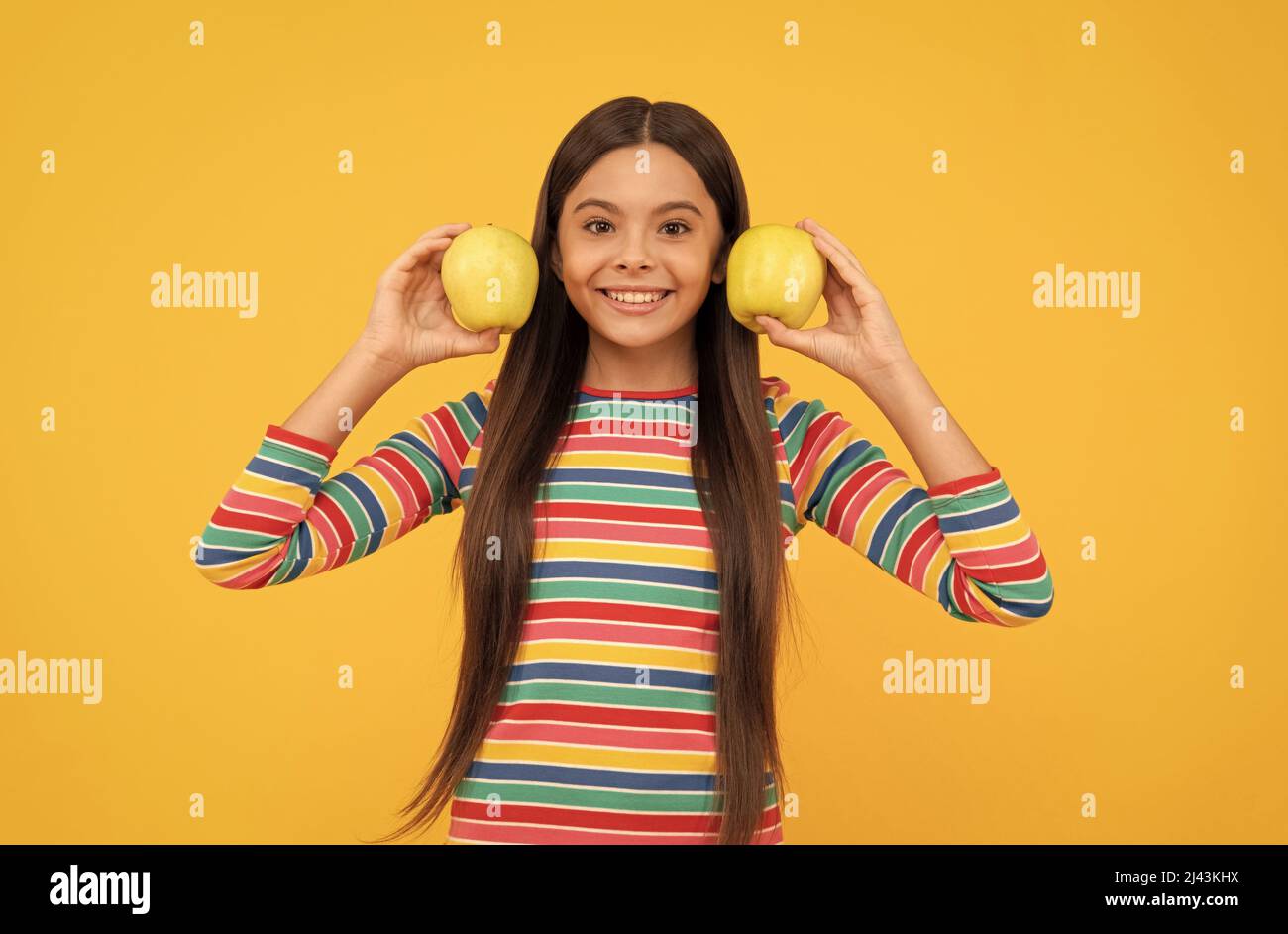 Say hello to a nice smile. Happy child smile holding apples. Healthy ...