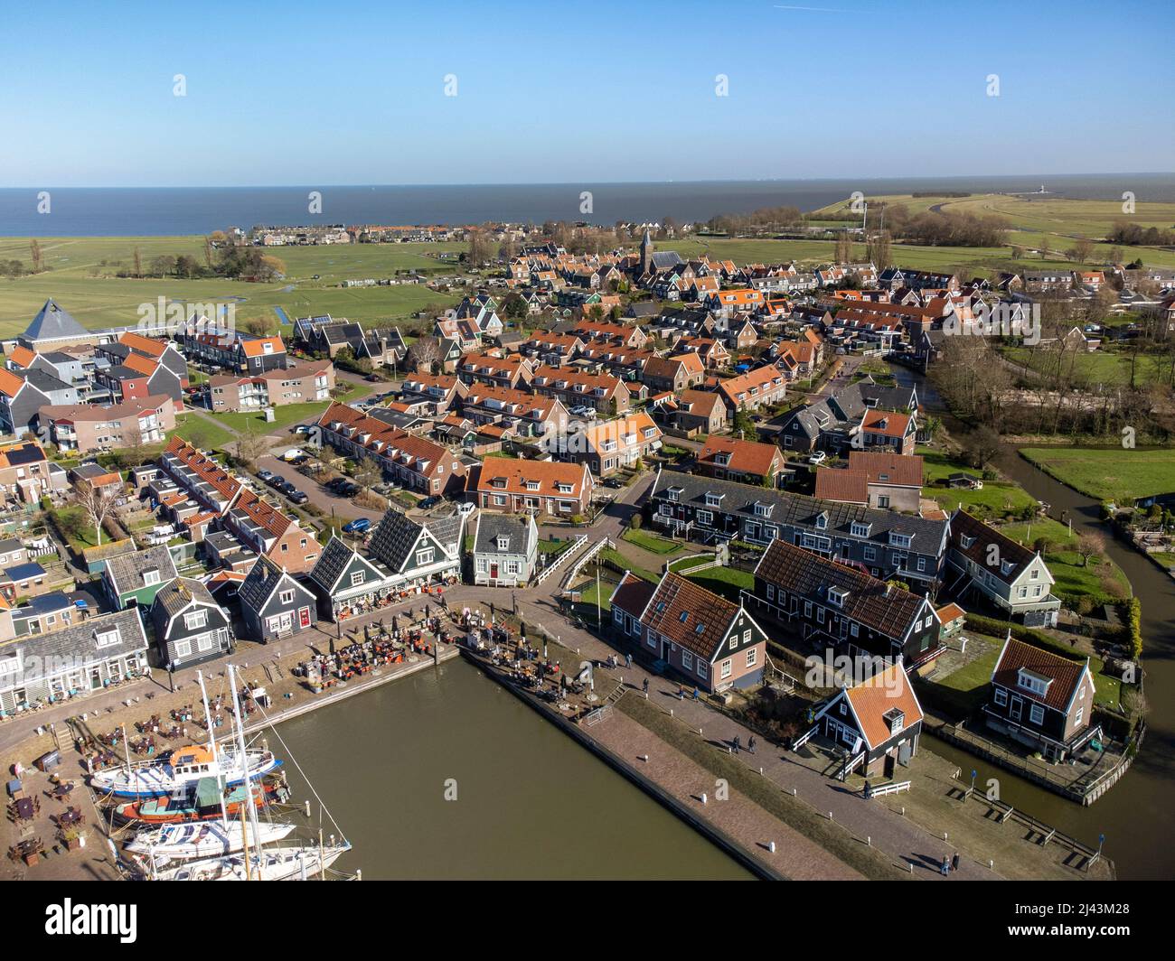 Aerial view on small Dutch town Marken with wooden houses located on ...