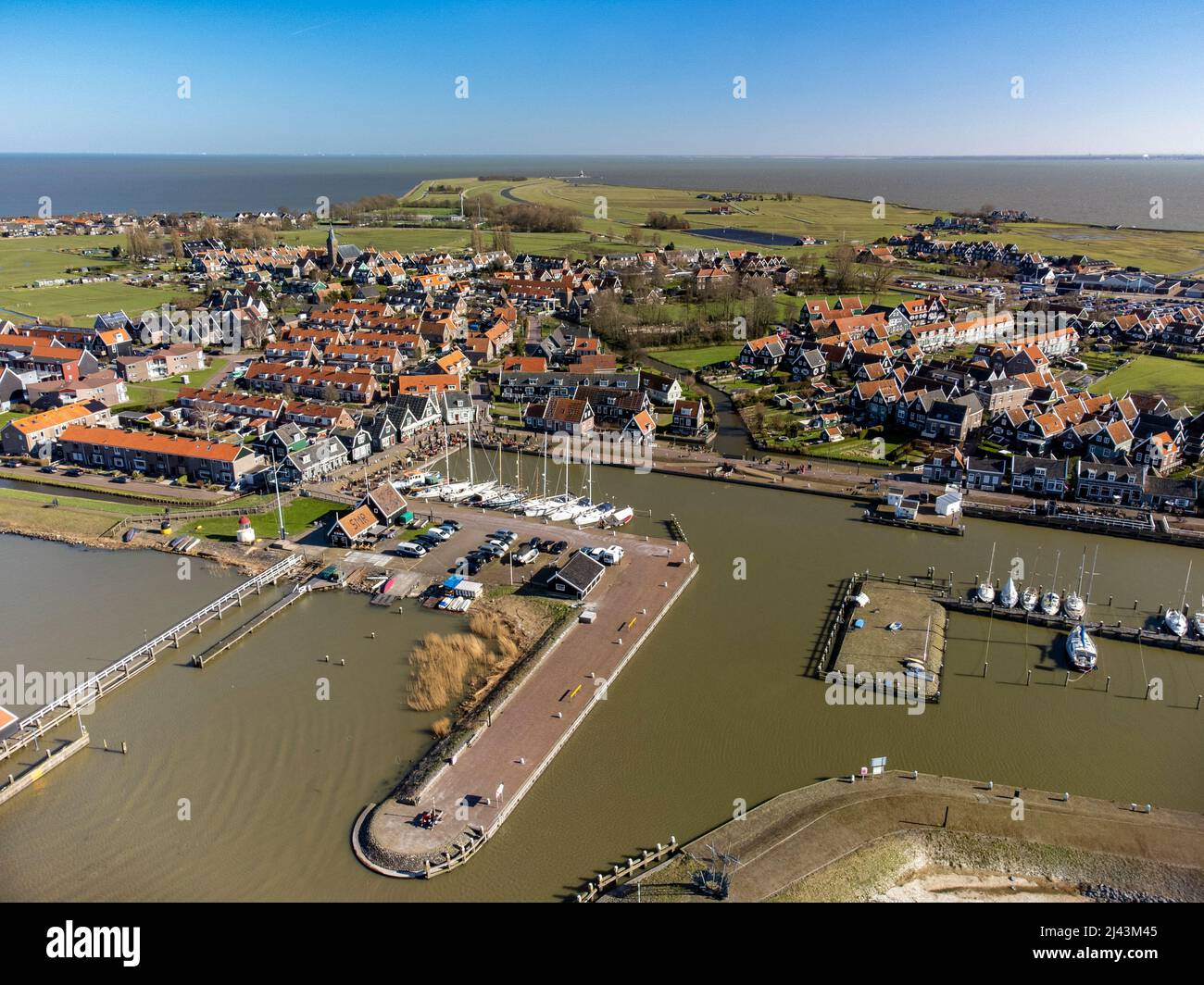 Aerial view on small Dutch town Marken with wooden houses located on ...