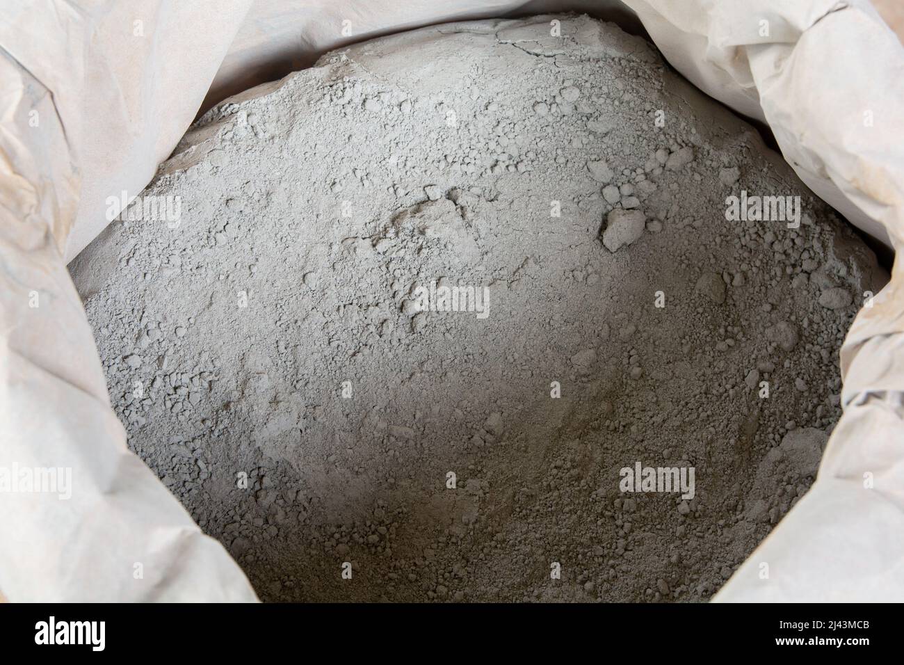 Cement powder in bag package Stock Photo - Alamy