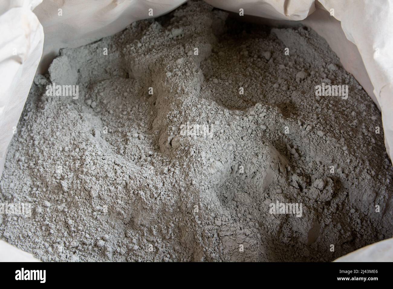 Cement powder in bag package Stock Photo - Alamy