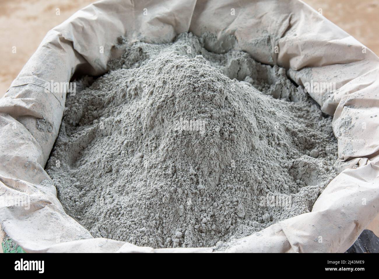 Cement powder in bag package Stock Photo - Alamy
