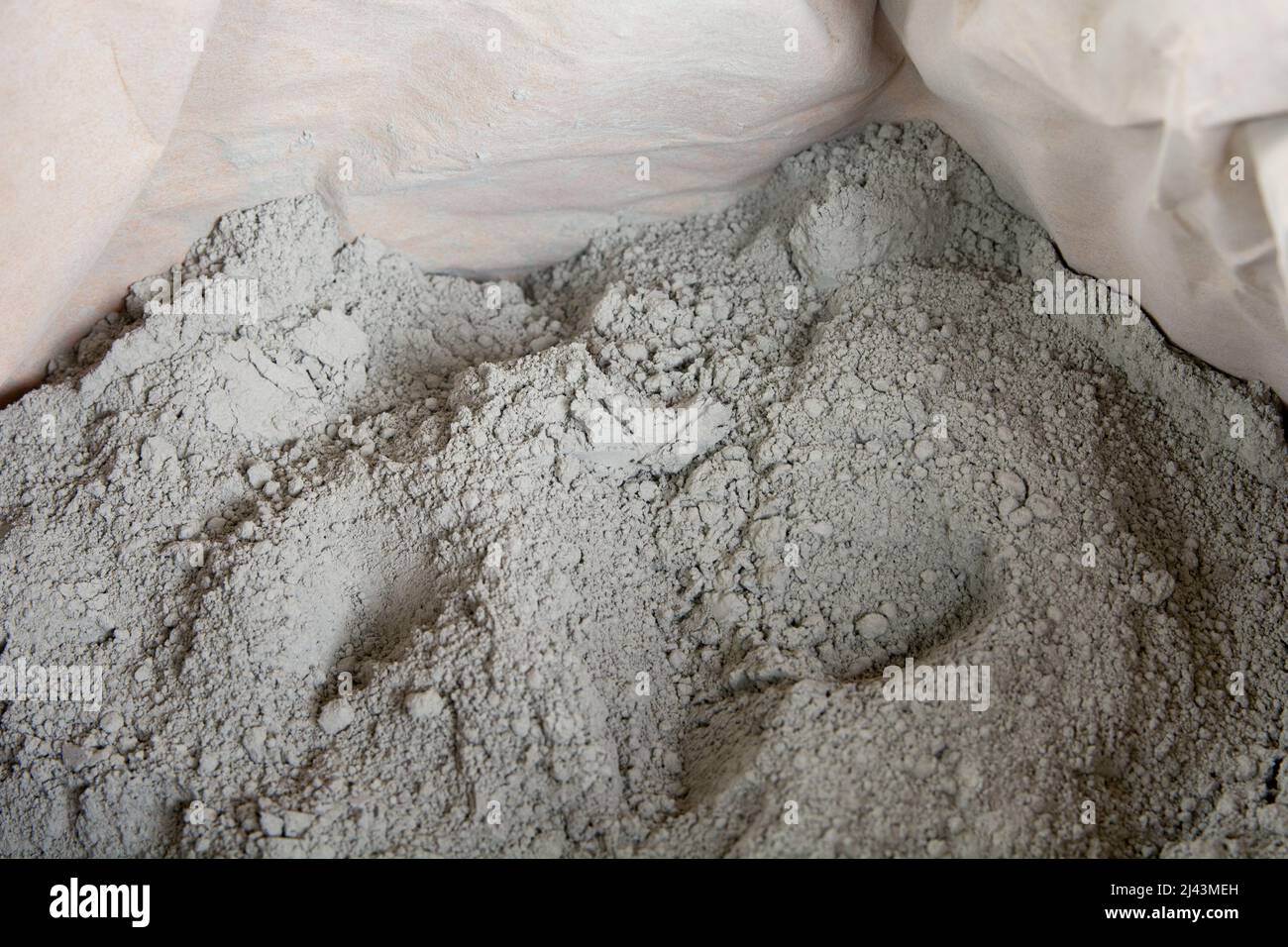 Cement powder in bag package Stock Photo - Alamy