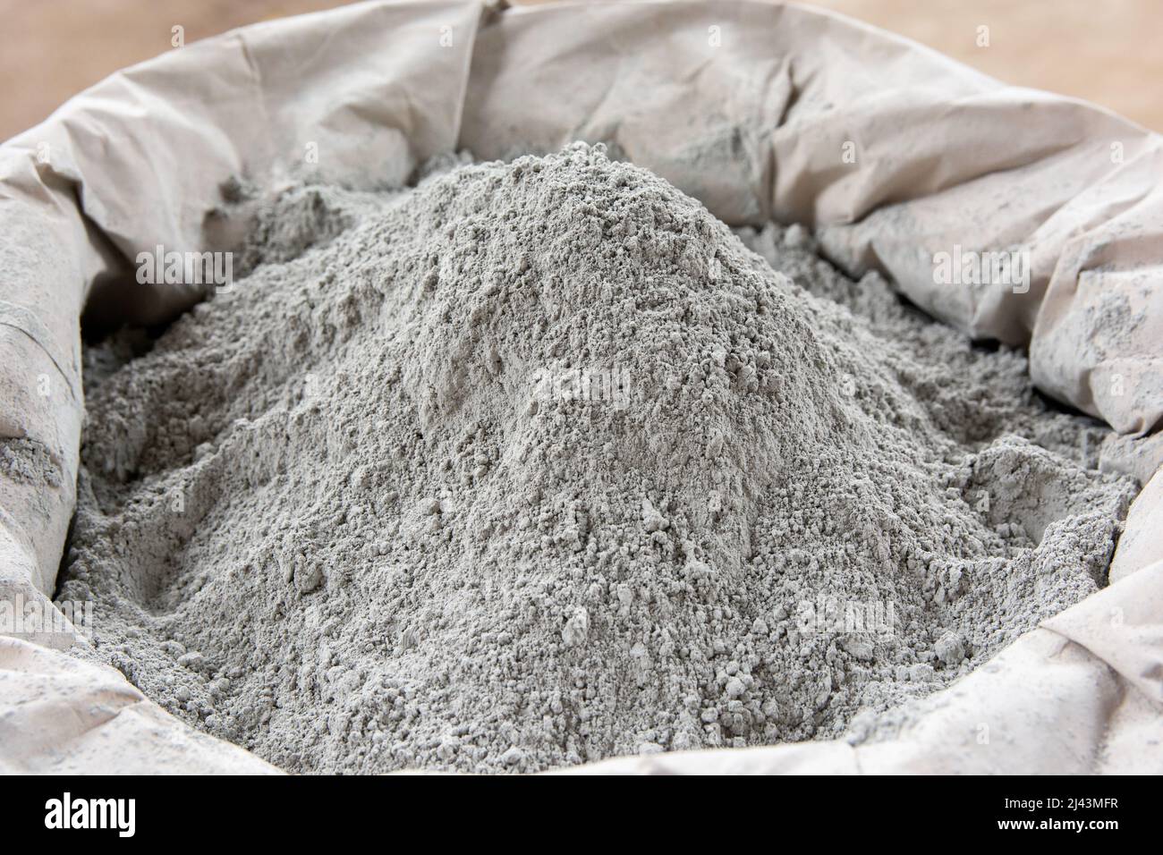 Cement powder in bag package Stock Photo - Alamy