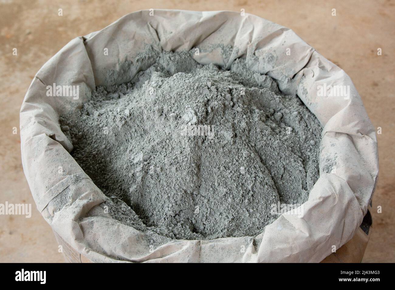 Cement powder in bag package Stock Photo - Alamy