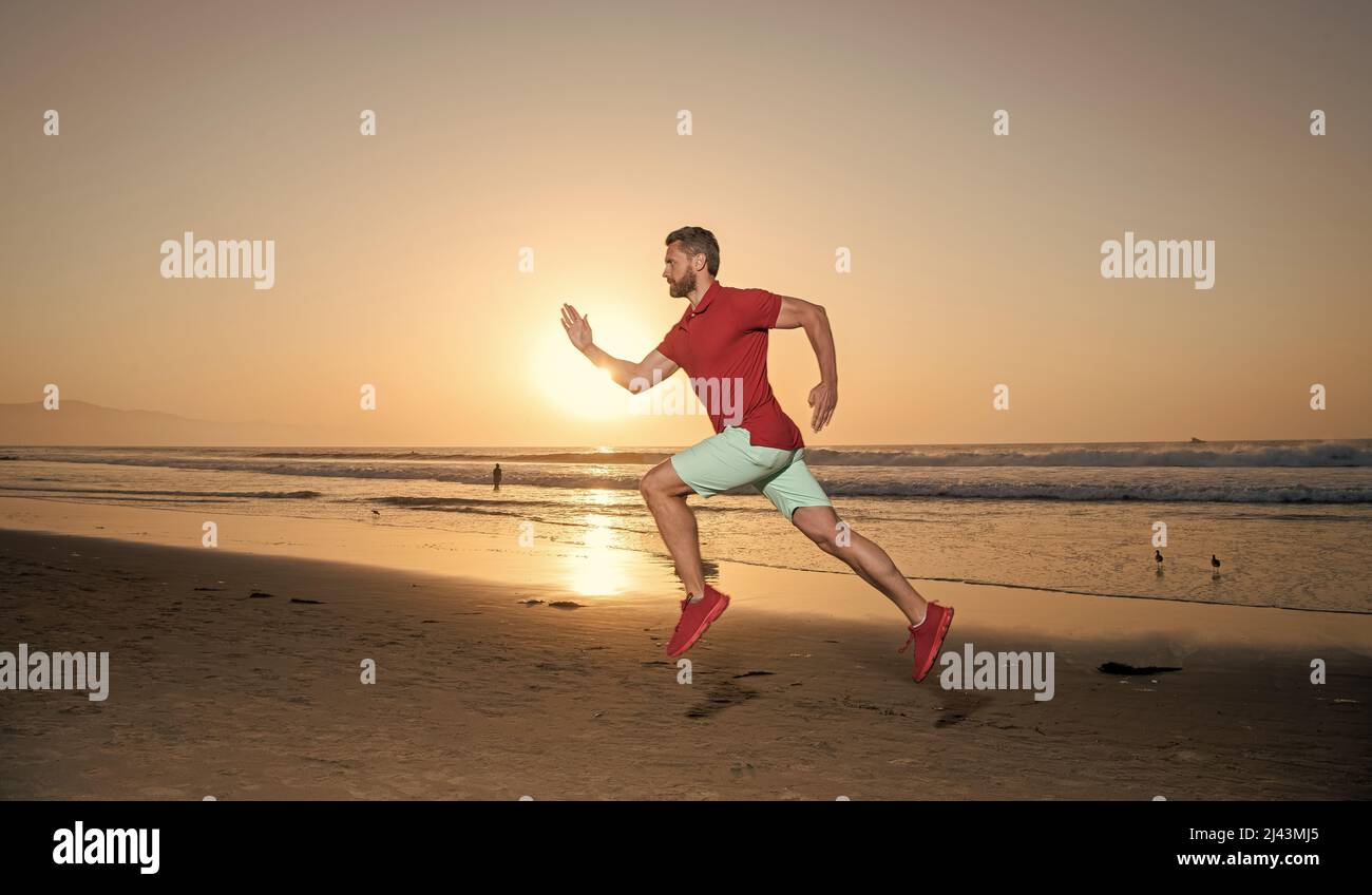 sportsman sprinter running on sunrise summer beach at ocean, jogging ...
