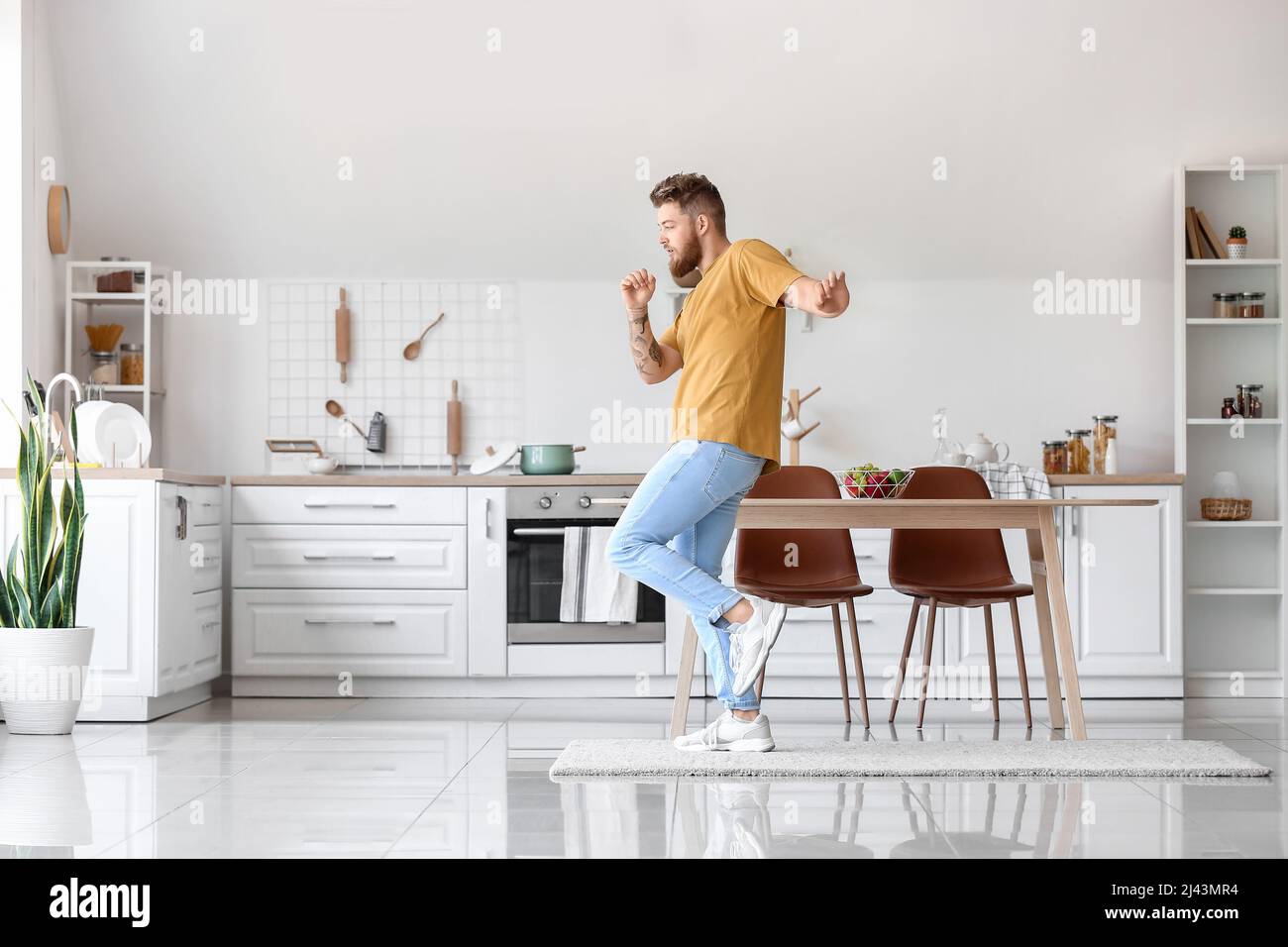 Cool young man dancing at home Stock Photo - Alamy