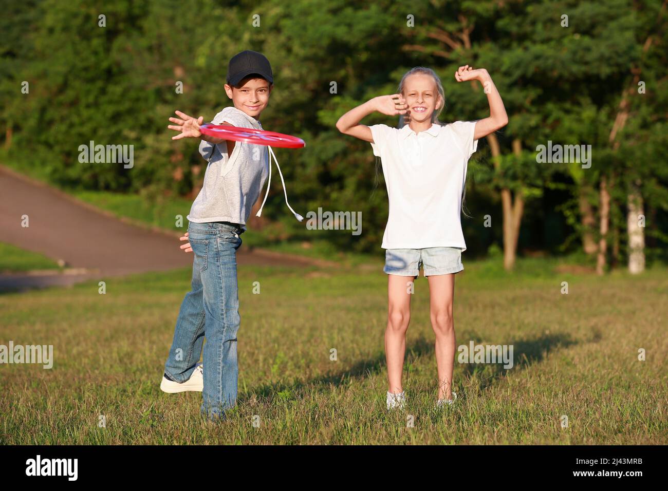Cute little children playing frisbee outdoors Stock Photo - Alamy