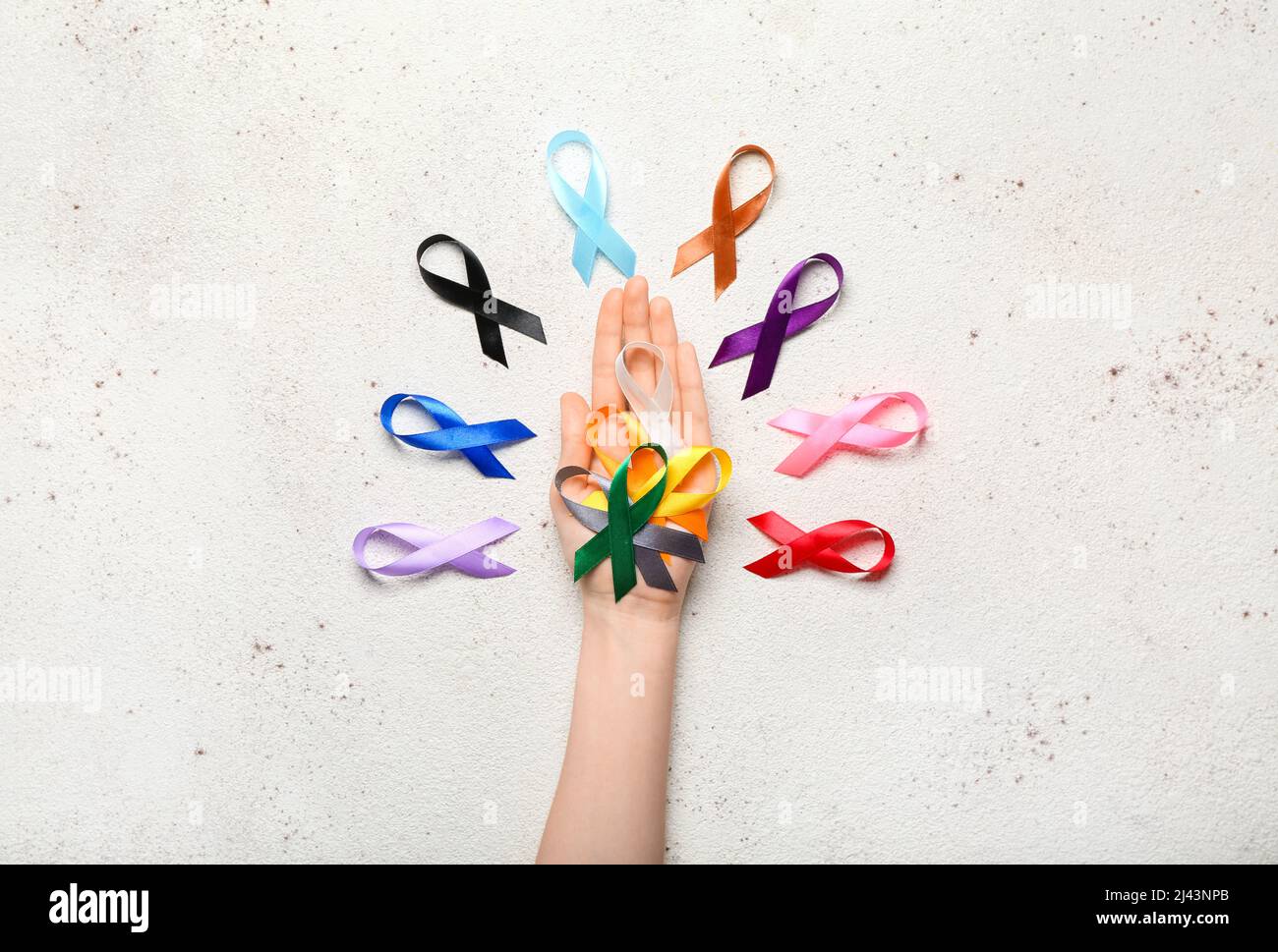 Woman different awareness ribbons hi-res stock photography and images ...