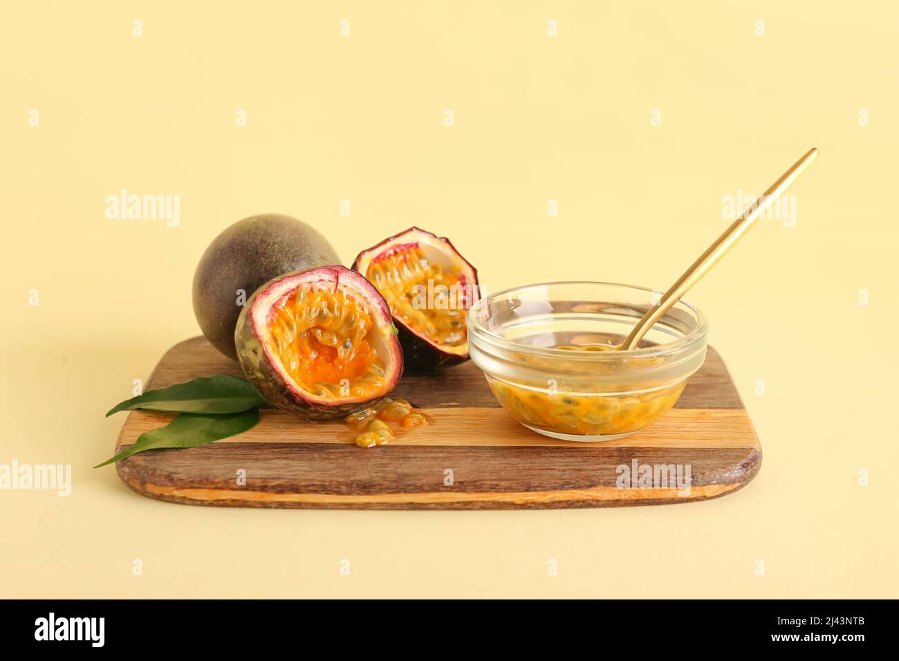 Bowl with passion fruit pulp on yellow background Stock Photo - Alamy
