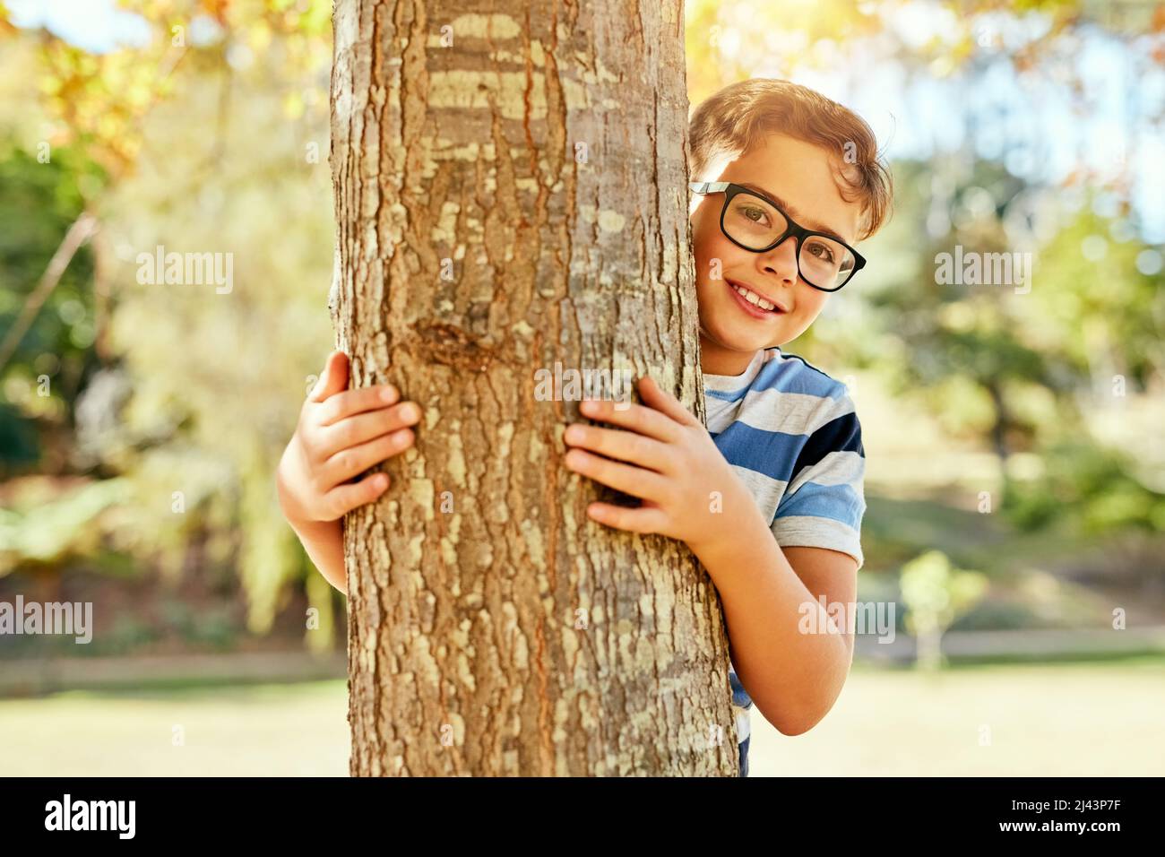 Children hiding outside hi-res stock photography and images - Alamy