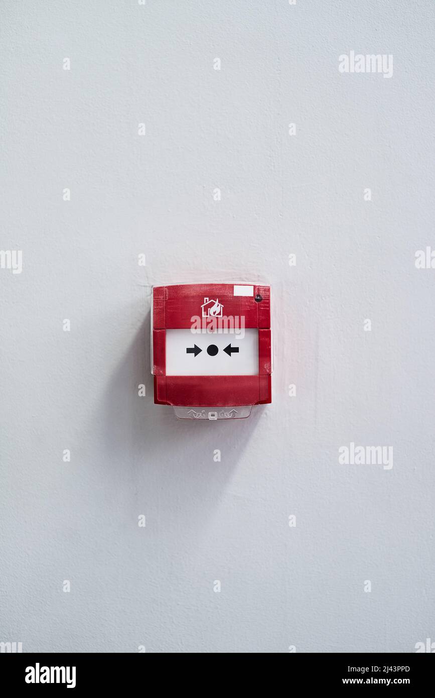Press in case of an emergency. Shot of a fire alarm on a wall Stock ...