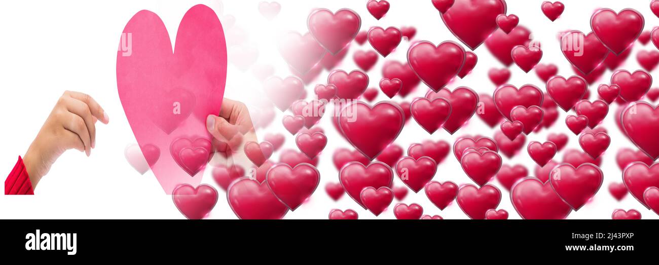 Couple hands holding a pink heart and multiple pink heart icons with ...