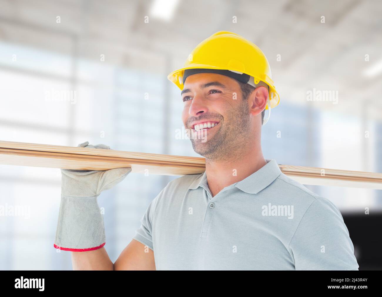 Caucasian male architect carrying a wooden plank against against office ...
