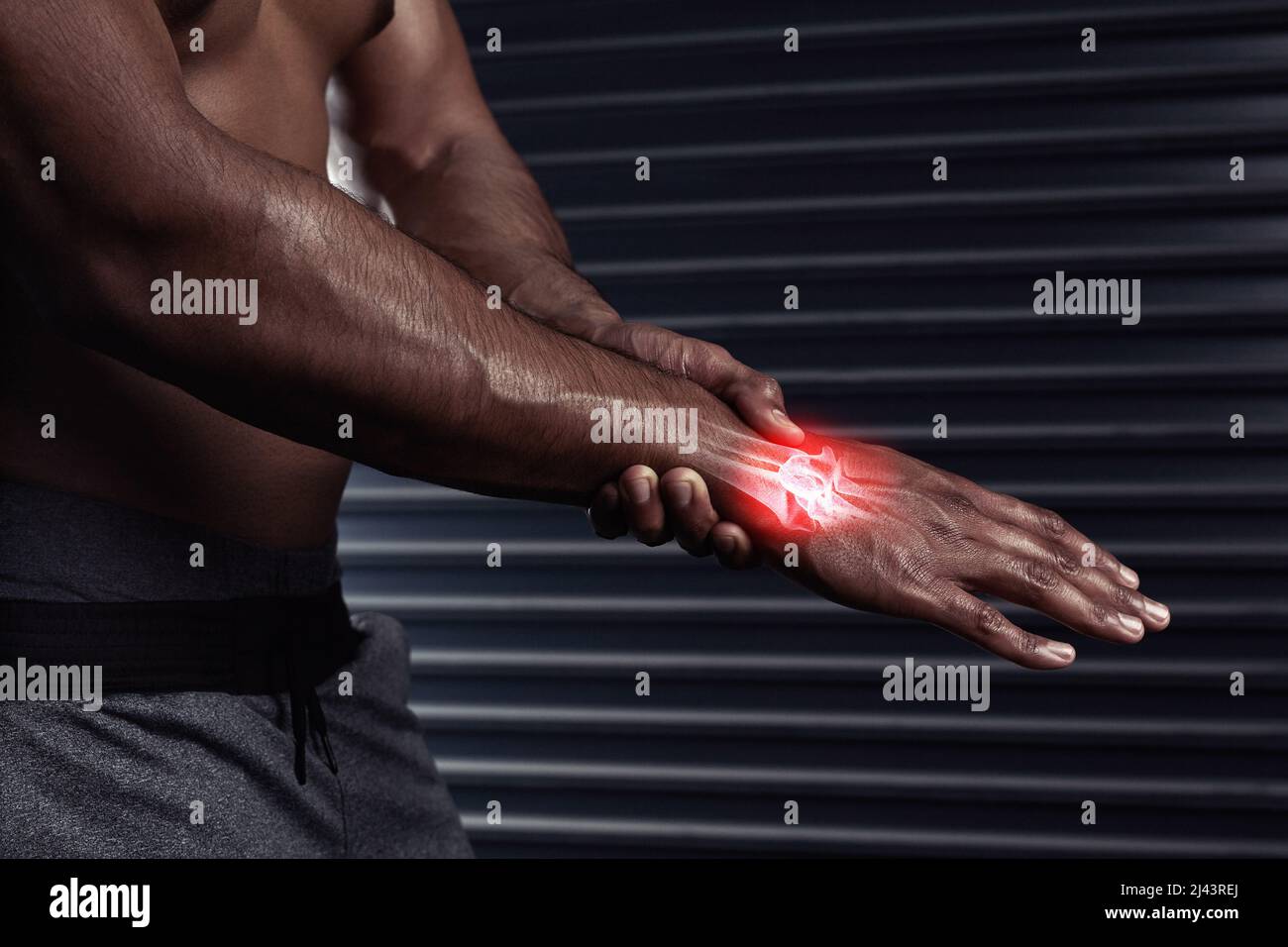 Hes injured his hand. Shot of an unrecognizable man rubbing his injured ...