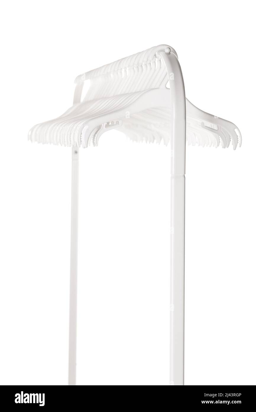 White plastic hangers for clothes hanging on rod from clothing rack ...