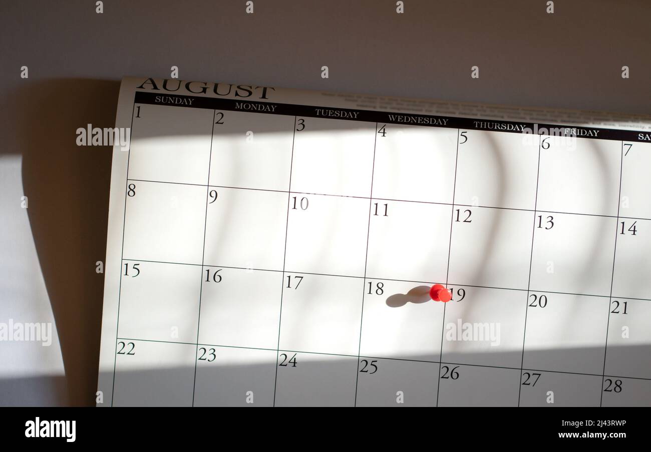 Calendar and marked the date with red pushpin. Top view Stock Photo - Alamy