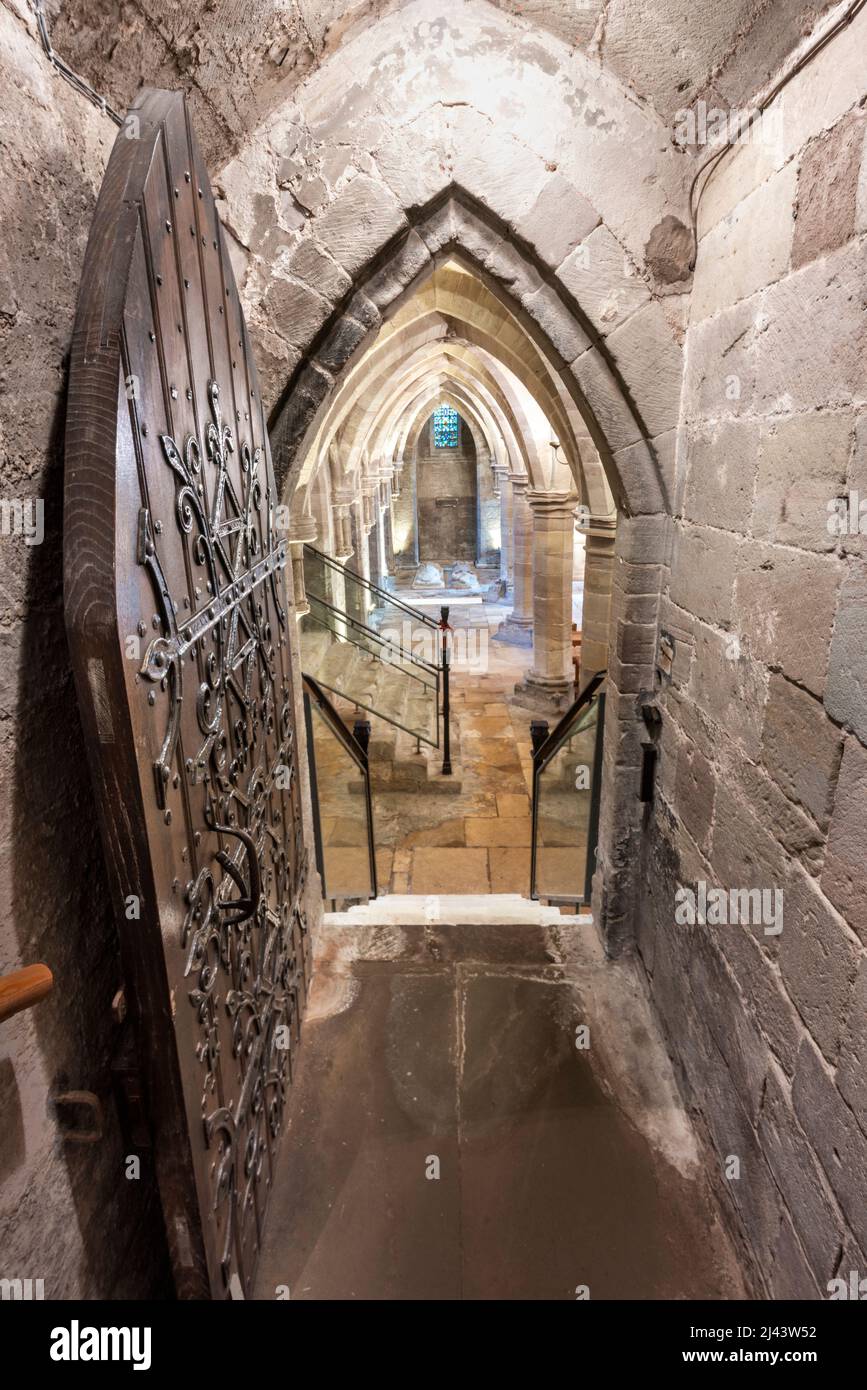 Ornate wooden door standing open,leading into elegantly lit ancient ...