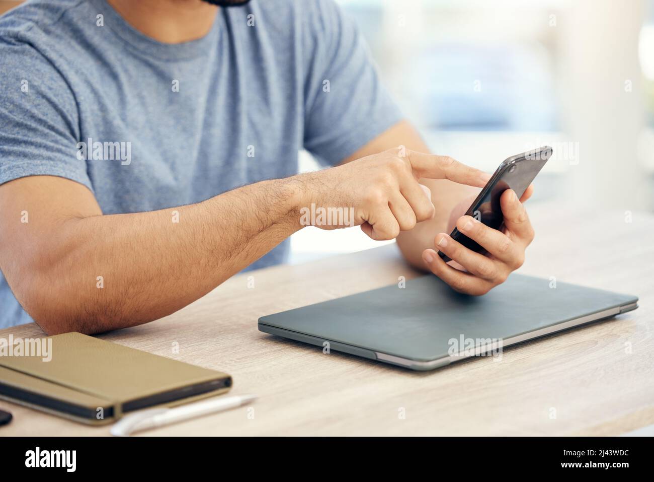 Just one tap will do. Shot of an unrecognizable businessman using a ...