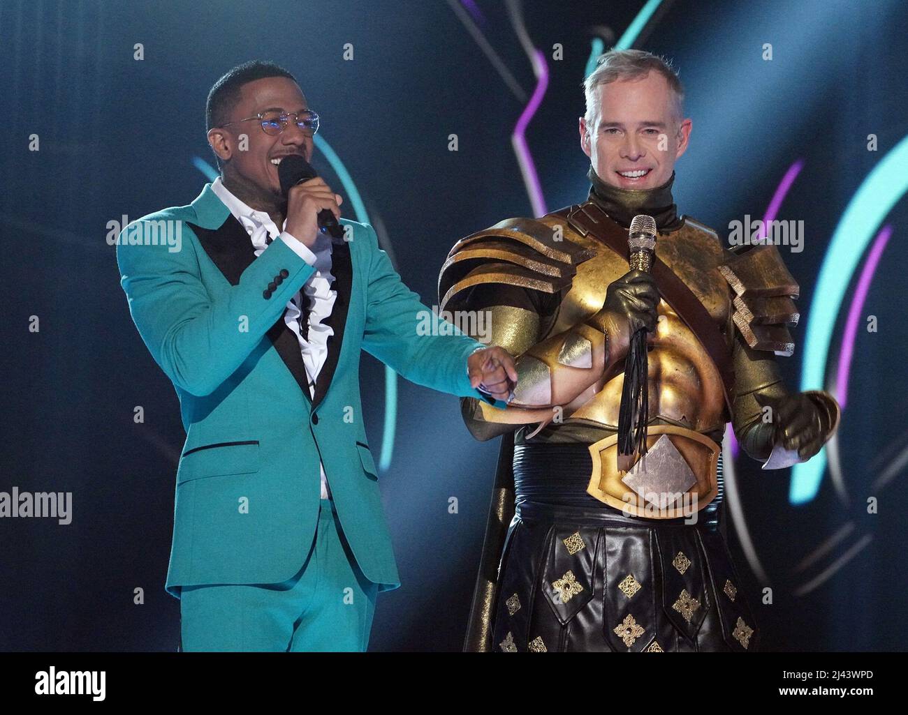 THE MASKED SINGER, from left: host Nick Cannon, Joe Buck (revealed as ...