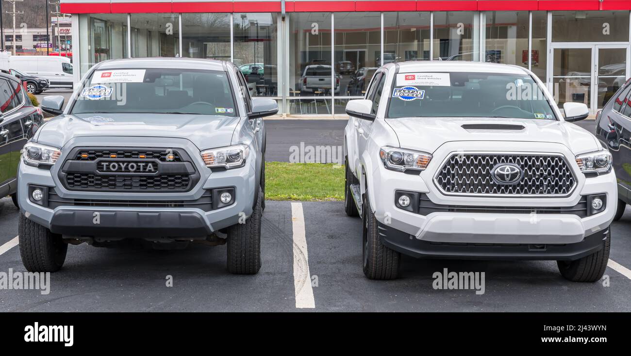 Two used Toyota Tacoma trucks together for sale at a dealership in ...