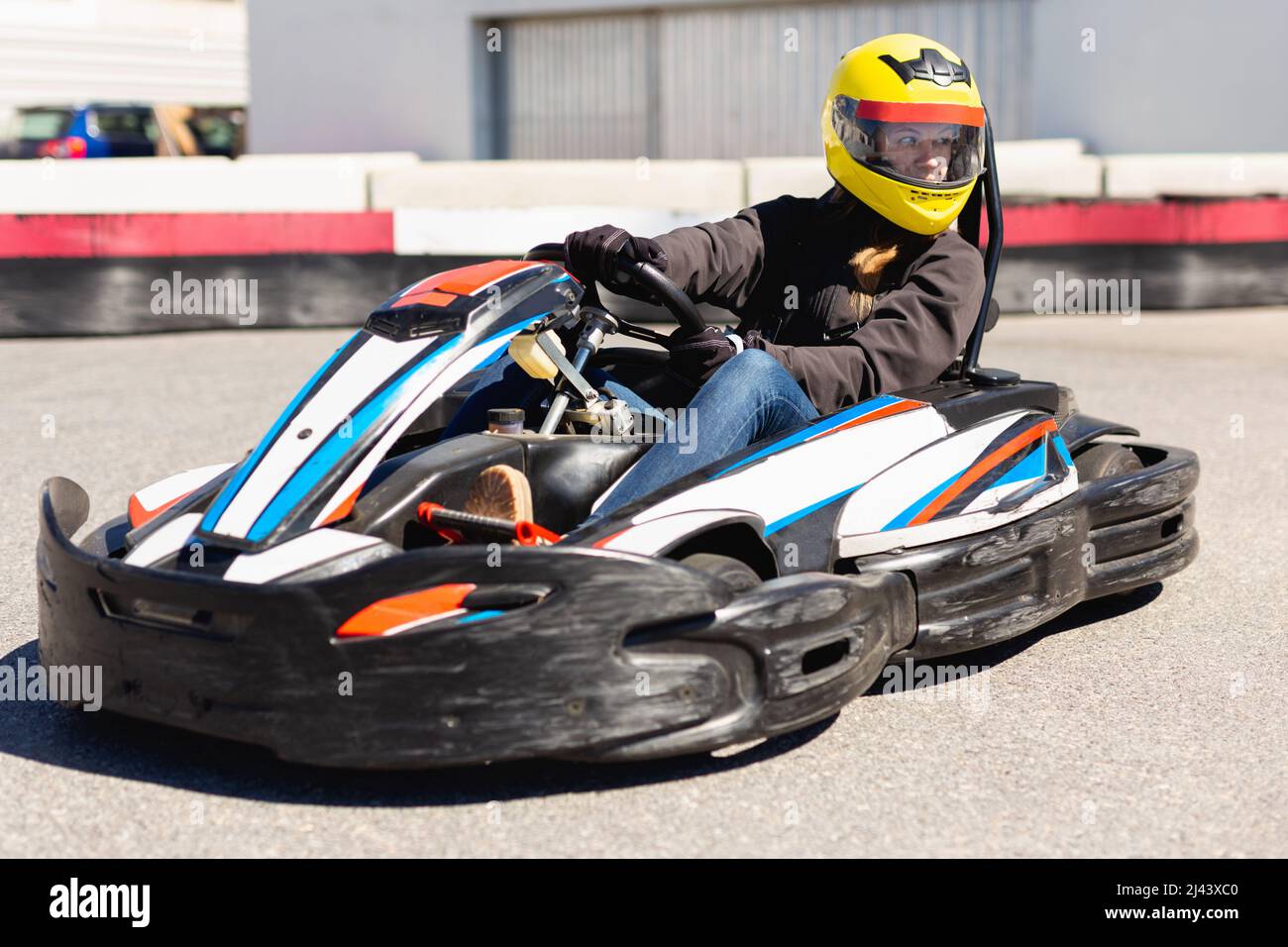 Female go-cart racer at kart circuit outdoors Stock Photo - Alamy