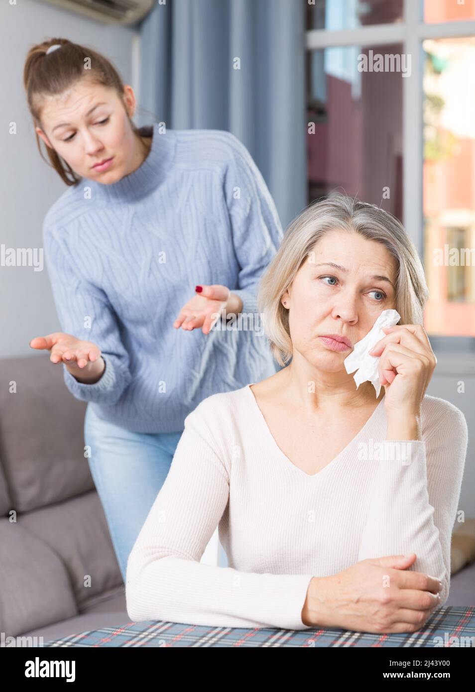 Offended mature woman turned away Stock Photo - Alamy