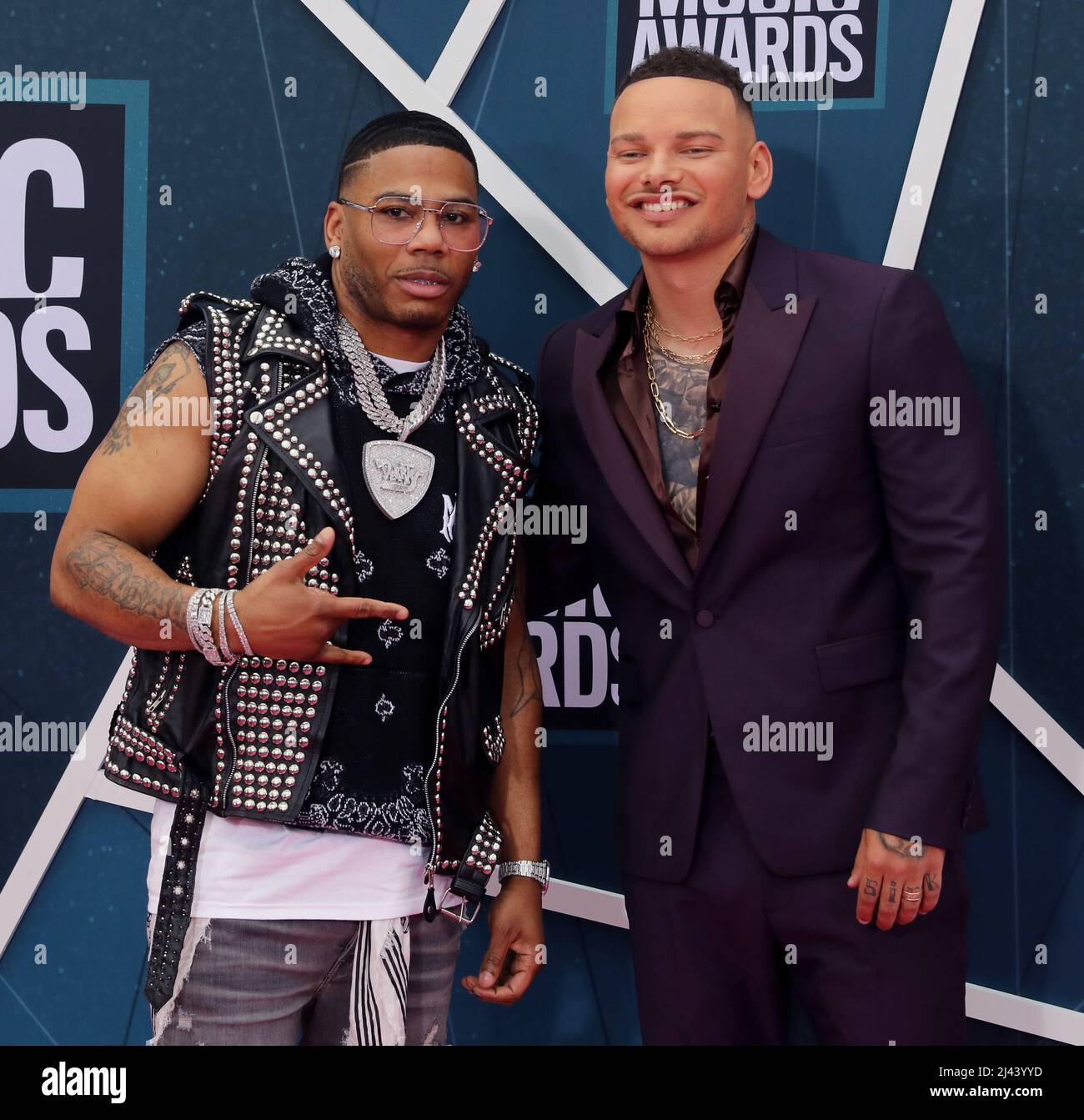 Nelly and Kane Brown are photographed on the red carpet for the CMT ...