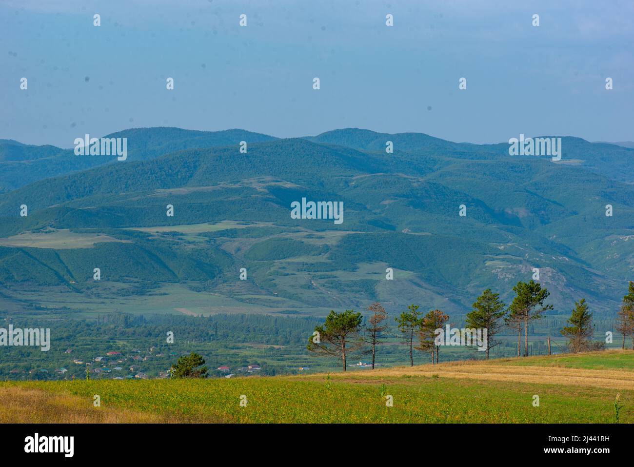 green fields and mountains in georgia in summer Stock Photo - Alamy